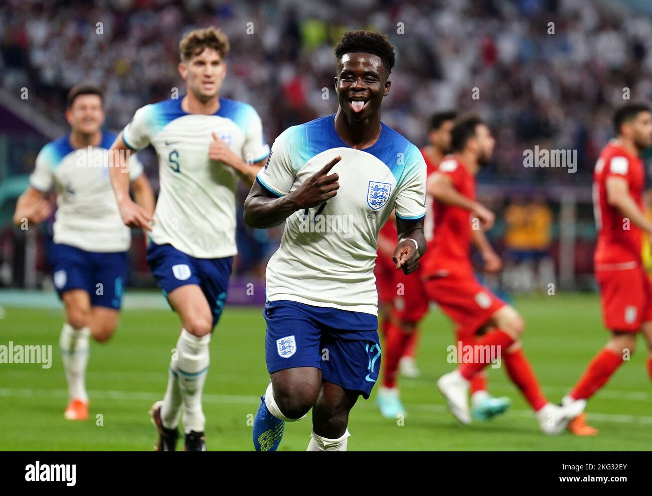 England's Bukayo Saka (centre) celebrates scoring their side's second ...