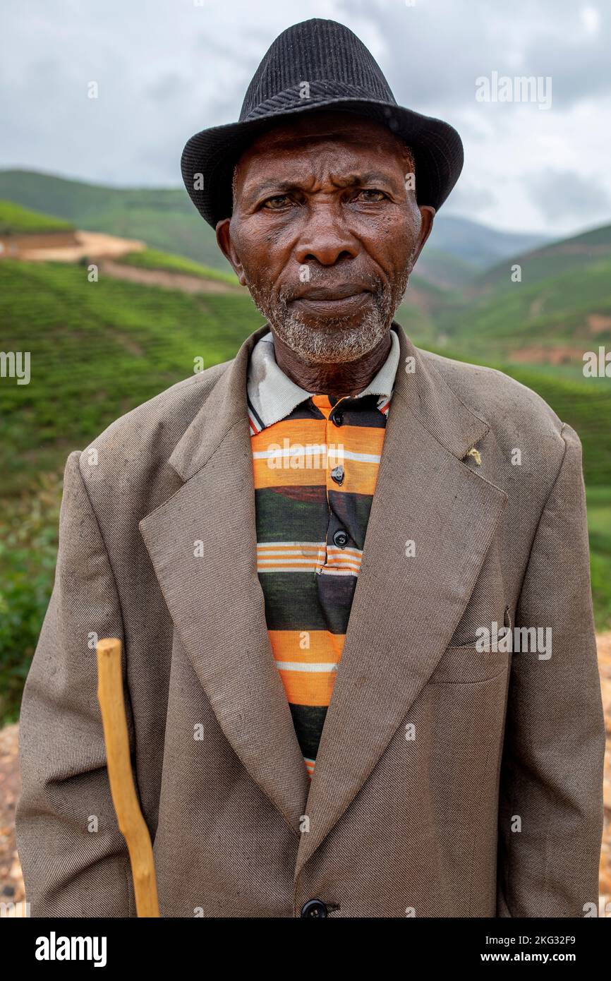 Elderly man standing in western Rwanda Stock Photo - Alamy