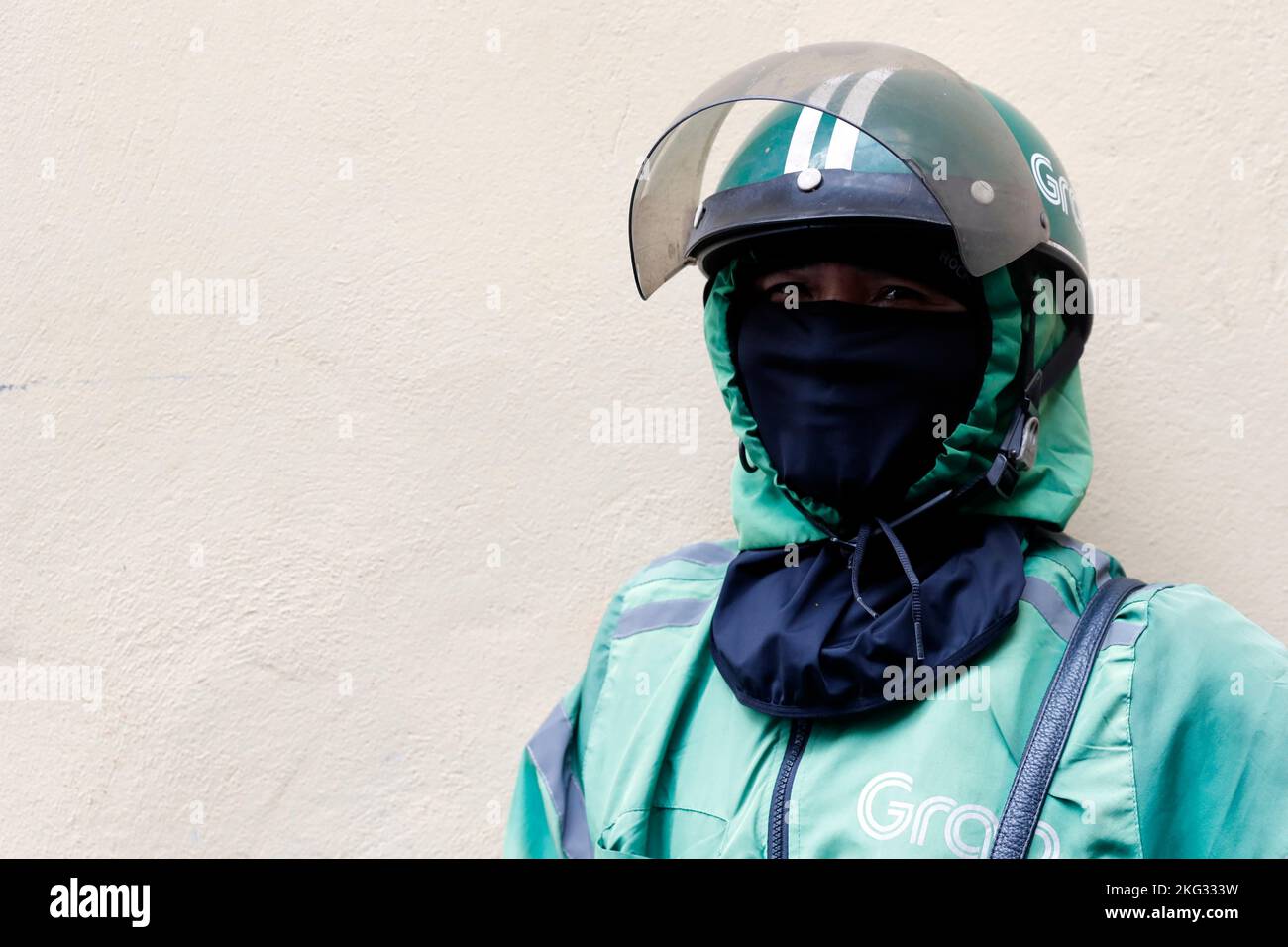 Grab driver with his helmet. Hanoi. Vietnam Stock Photo - Alamy
