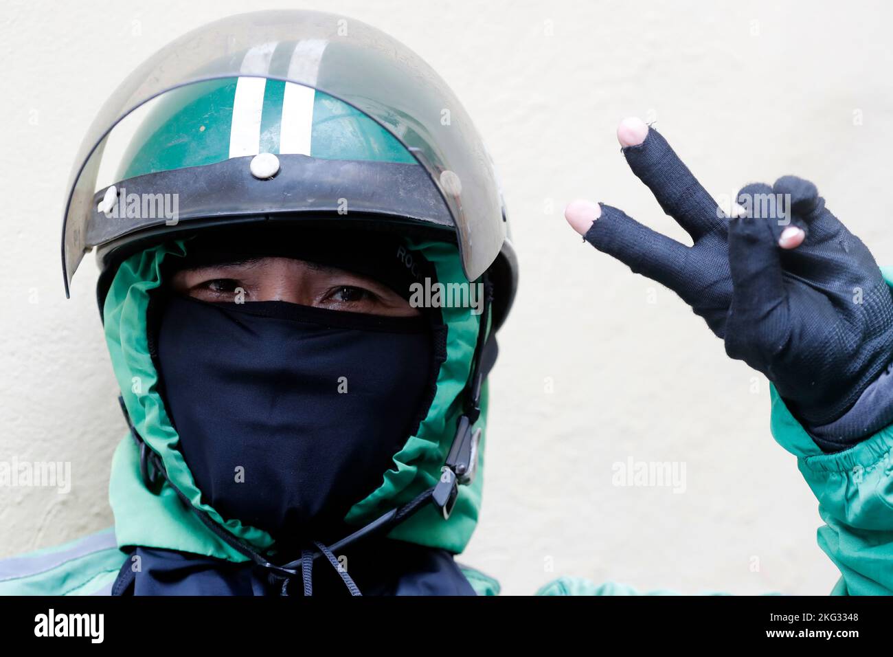 Grab driver with his helmet. Hanoi. Vietnam Stock Photo - Alamy