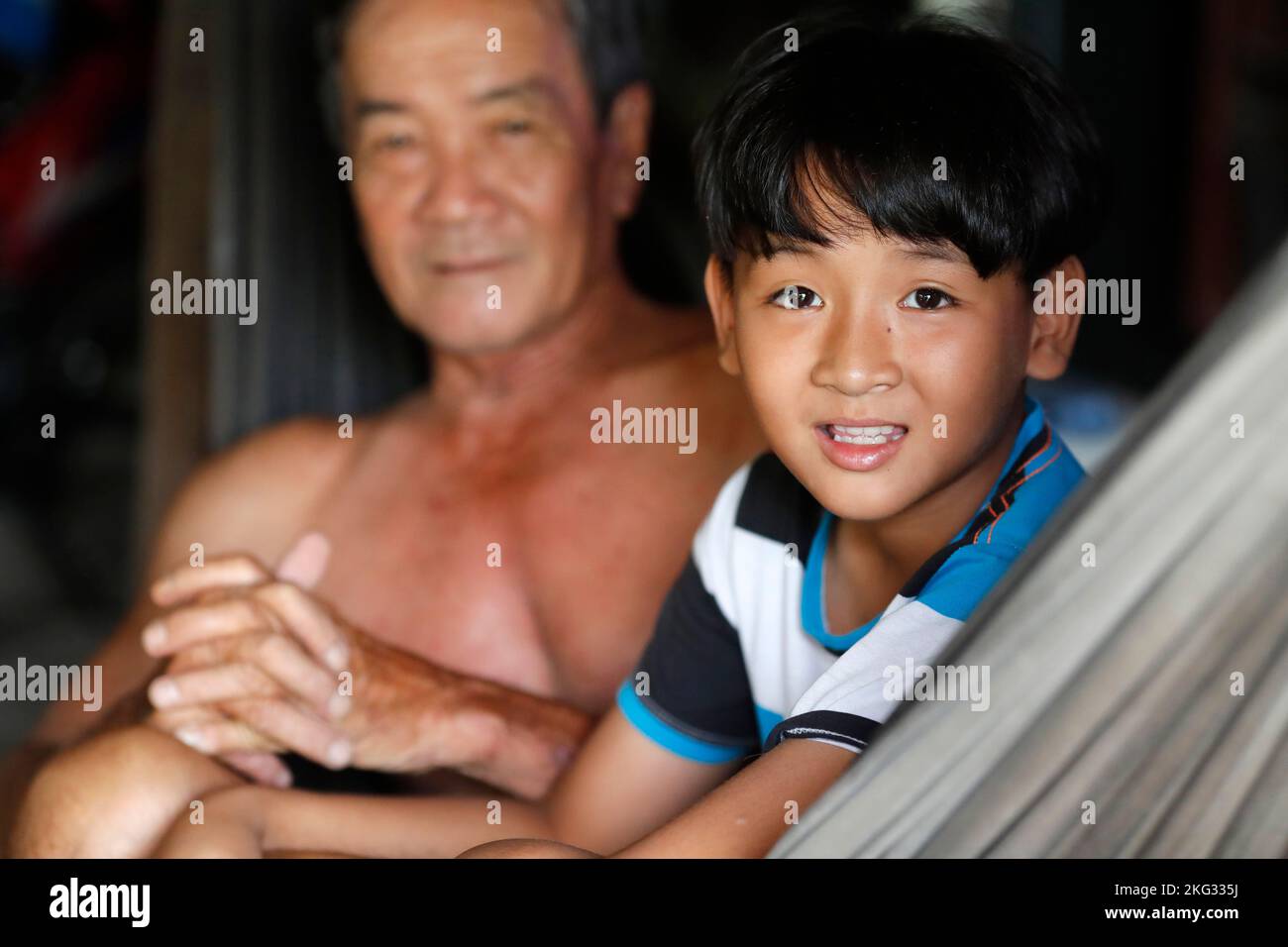 Portrait of a young boy with his father. Tan Chau. Vietnam Stock Photo ...
