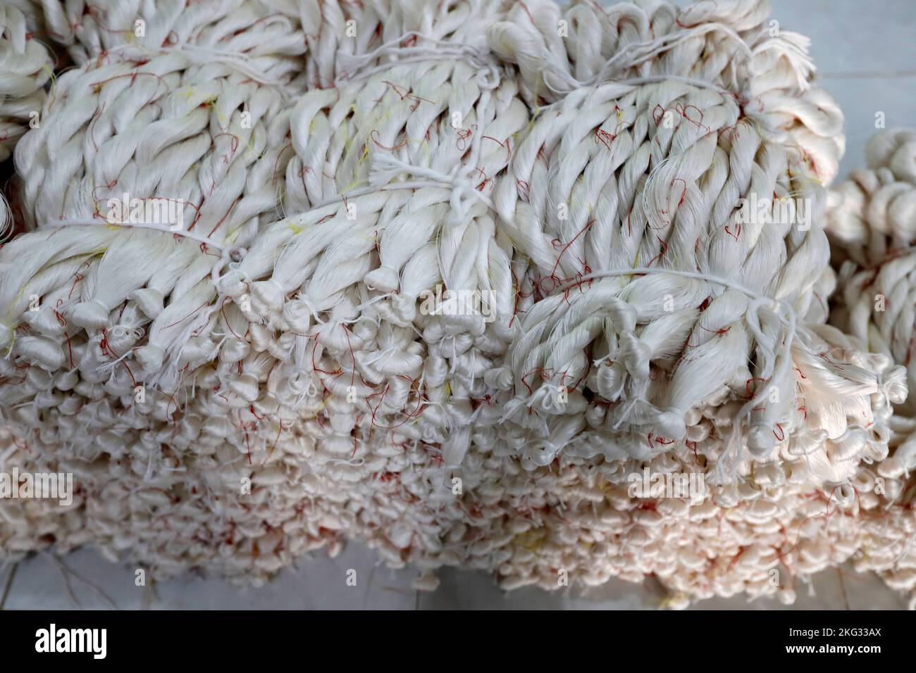 A traditional silk factory. Bobbins of silk threads. Tan Chau. Vietnam ...