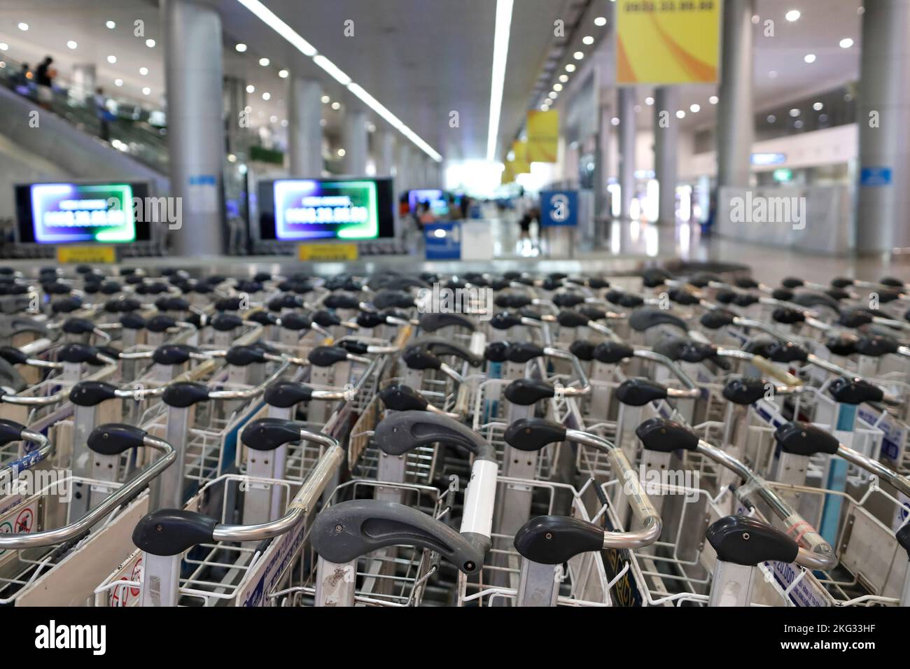 International airport. Baggage trolleys in arrivals area. Vietnam Stock ...
