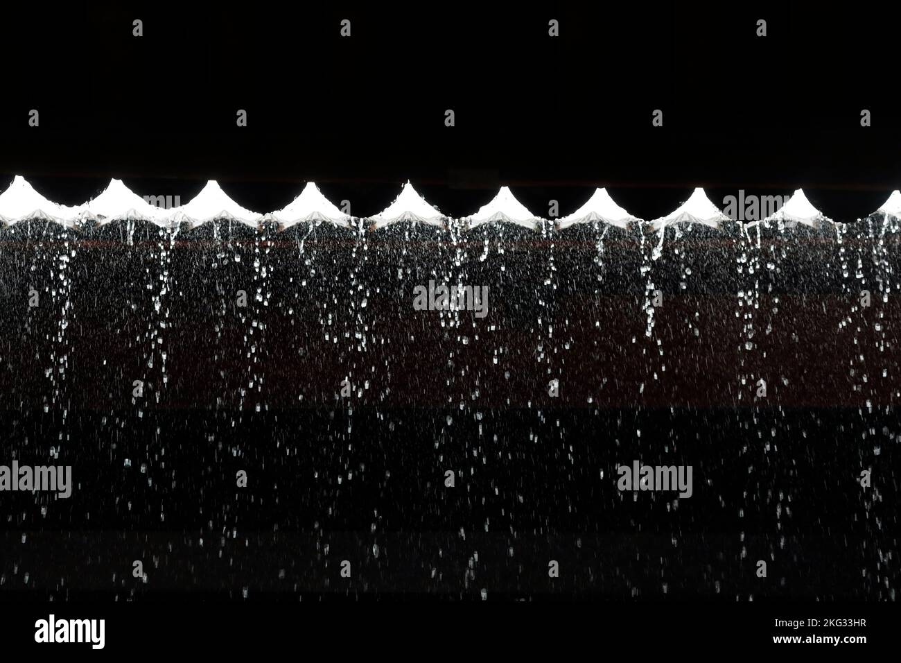 Rain drops falling over roof during monsoon. Rainy day and rainy season ...