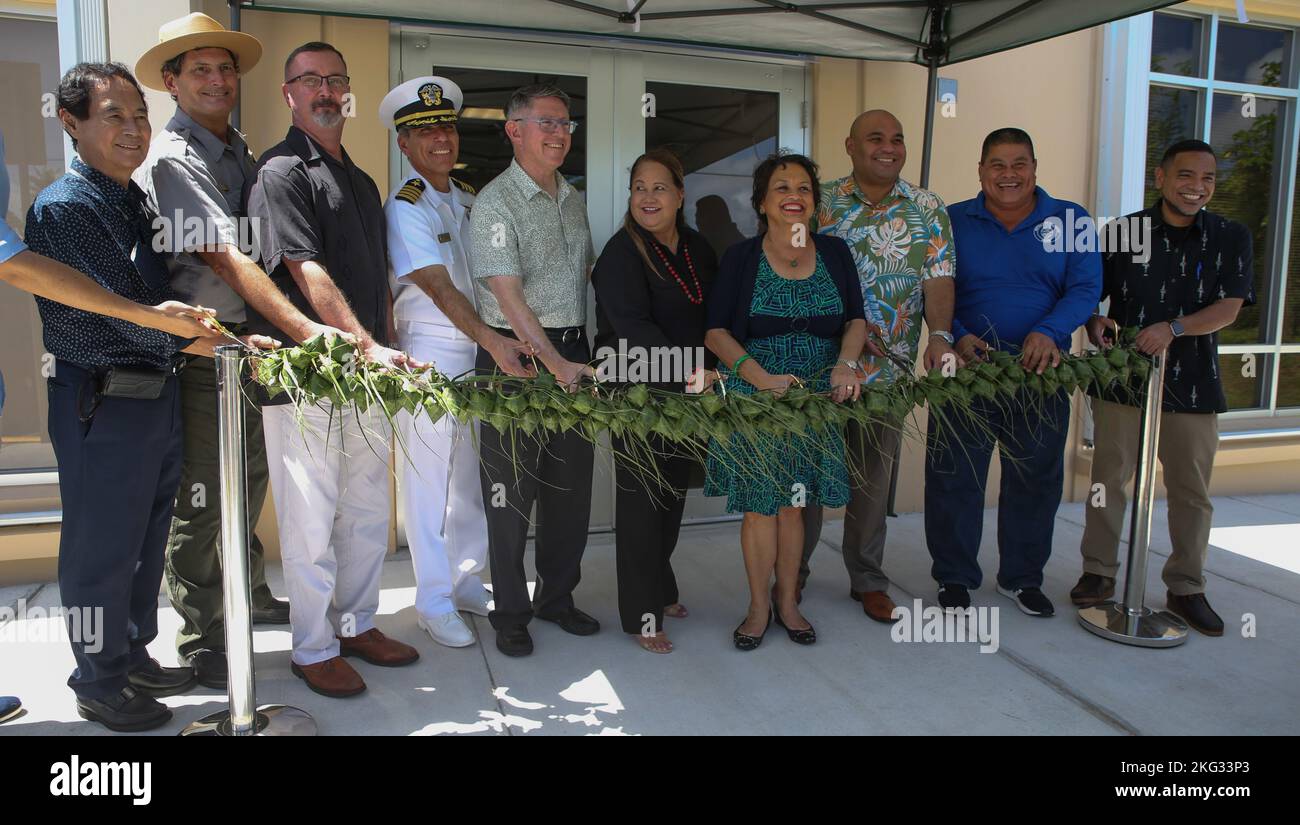 Guam government officials and U.S. service members prepare to cut a ...