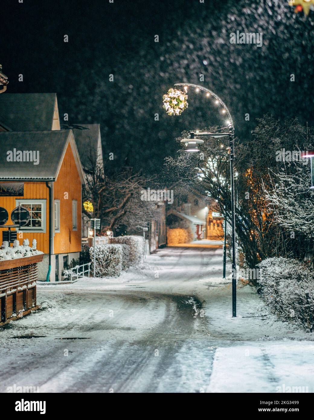 Snow and winter night in a small Swedish towns main road Stock Photo ...