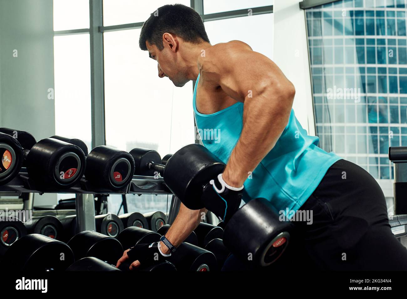 Close up of man using dumbbell exercise at gym, Sport concept Stock ...