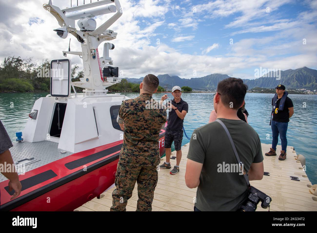 NG Chee Wee, center, ST Engineering, delivers a demonstration brief to ...