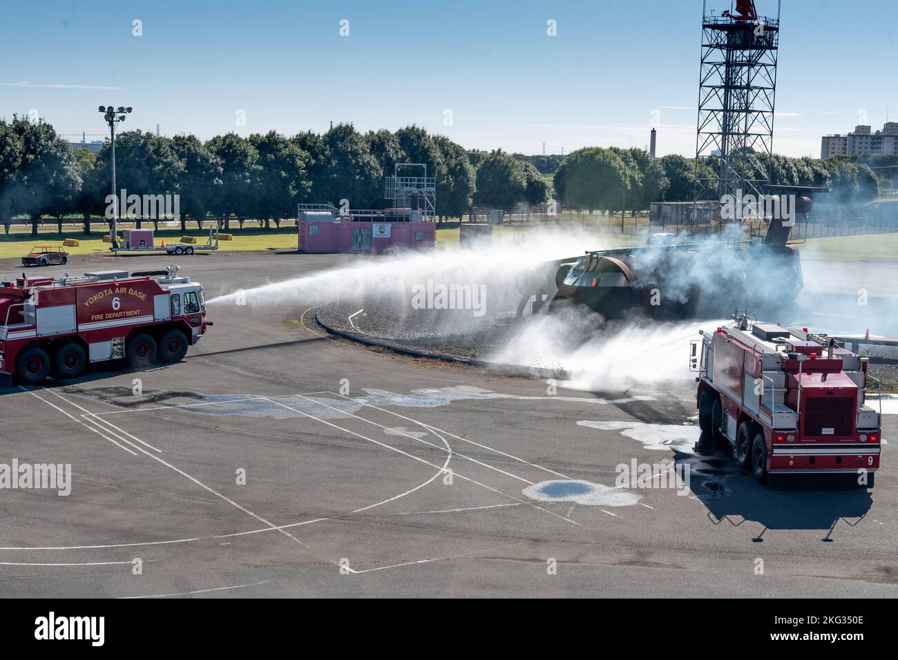 Firefighters from the 374th Civil Engineer Squadron use fire truck ...