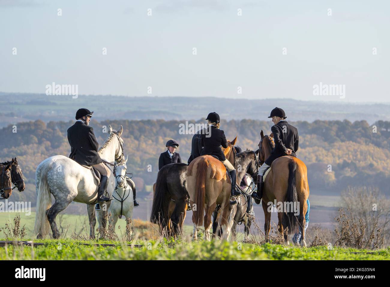 UK fox hunting: a group of riders on horseback standing together in a ...