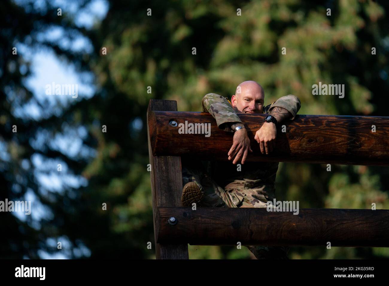 Sgt. 1st Class Cory Fowler from Madigan Army Medical Center, climbs to ...
