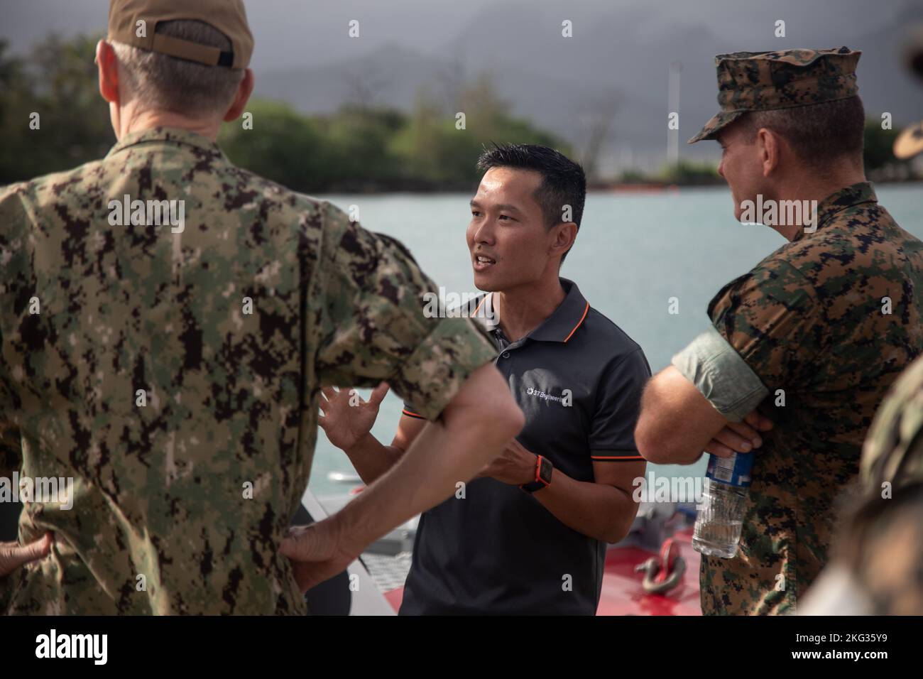 NG Chee Wee, center, ST Engineering, delivers a demonstration brief to ...