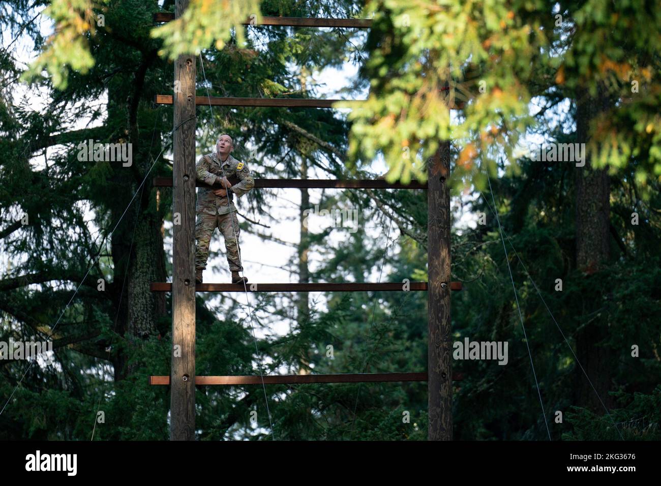 Sgt. 1st Class Cory Fowler from Madigan Army Medical Center, climbs to ...
