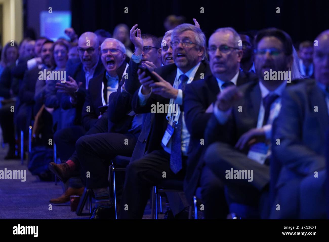 Conference attendees celebrate as they watch the England v Iran FIFA ...