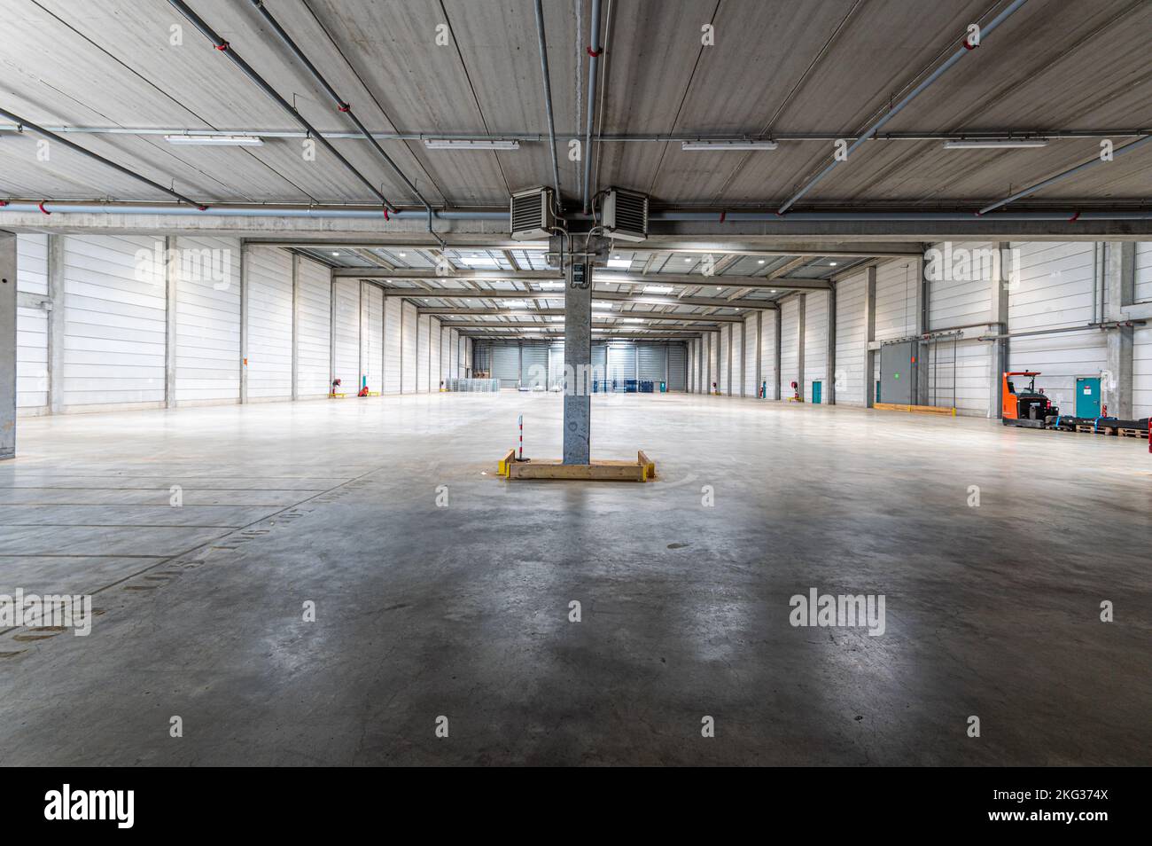 A shot of empty stockroom under solid steel roof Stock Photo - Alamy