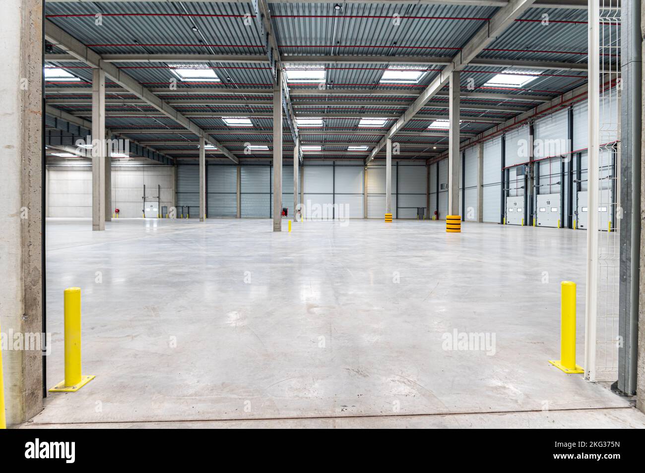 An empty and large warehouse workshop polished concrete floor Stock ...