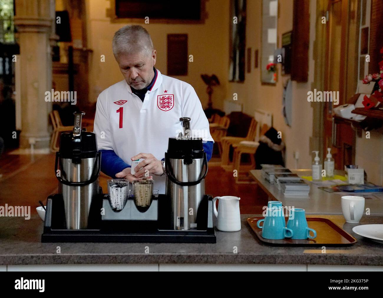 A football fan makes a cup of tea during half time in the England v ...