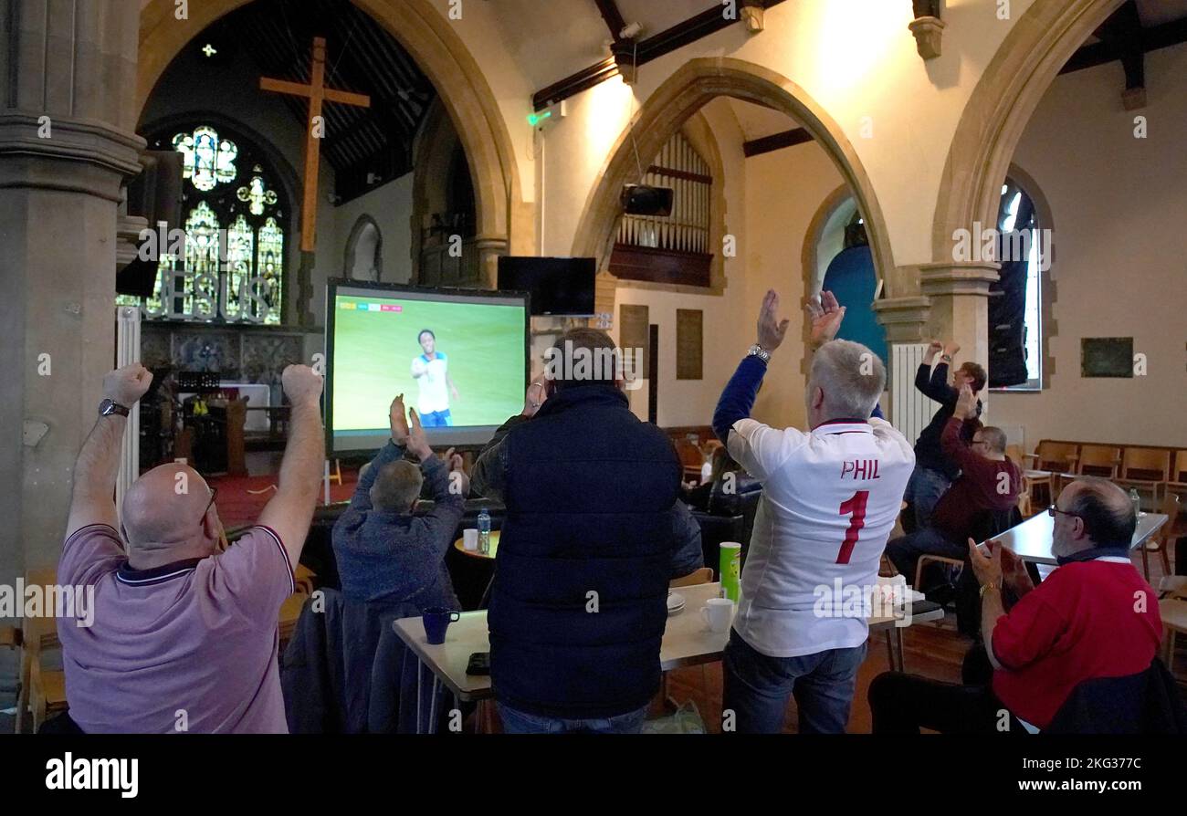 Fans celebrate England's third goal as they watch the England v Iran ...