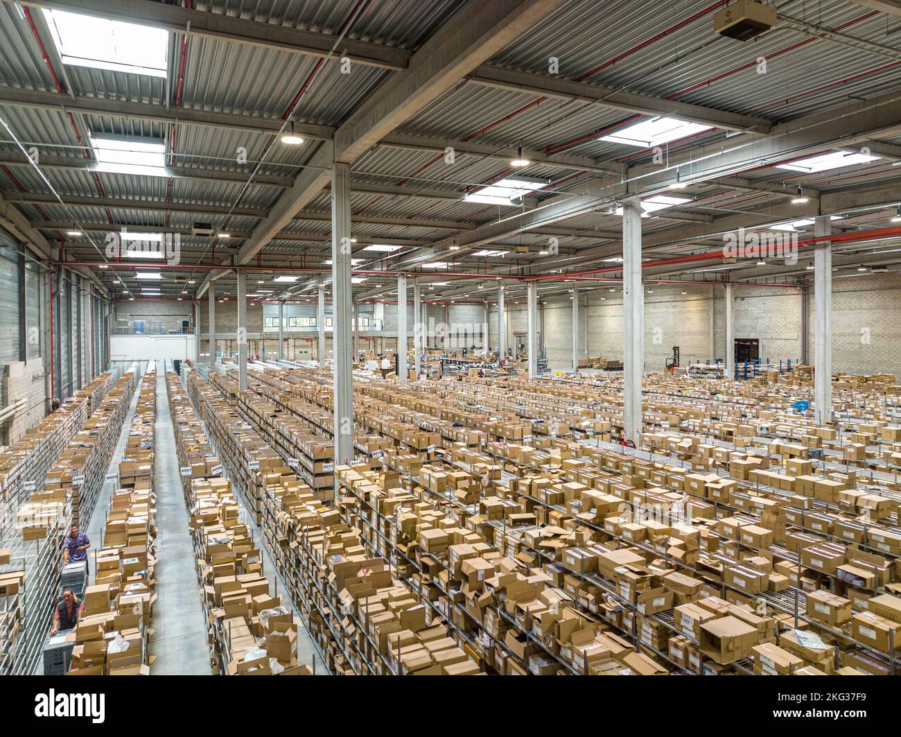 A wide shot of rows of shelves with goods boxes in modern industry ...