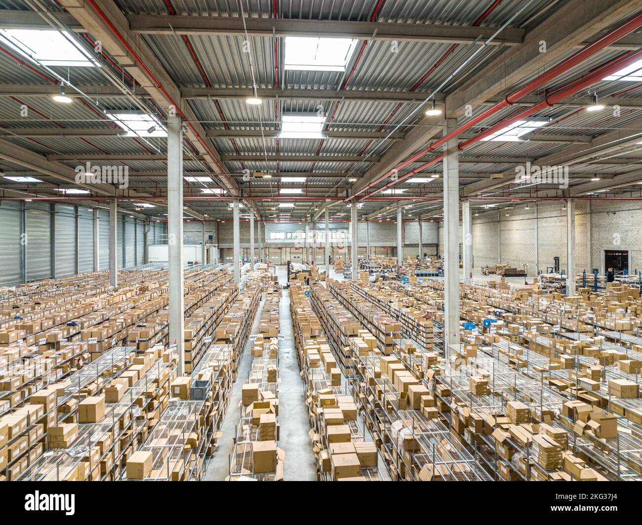 Perspective shot of rows of shelves with goods boxes in modern industry ...