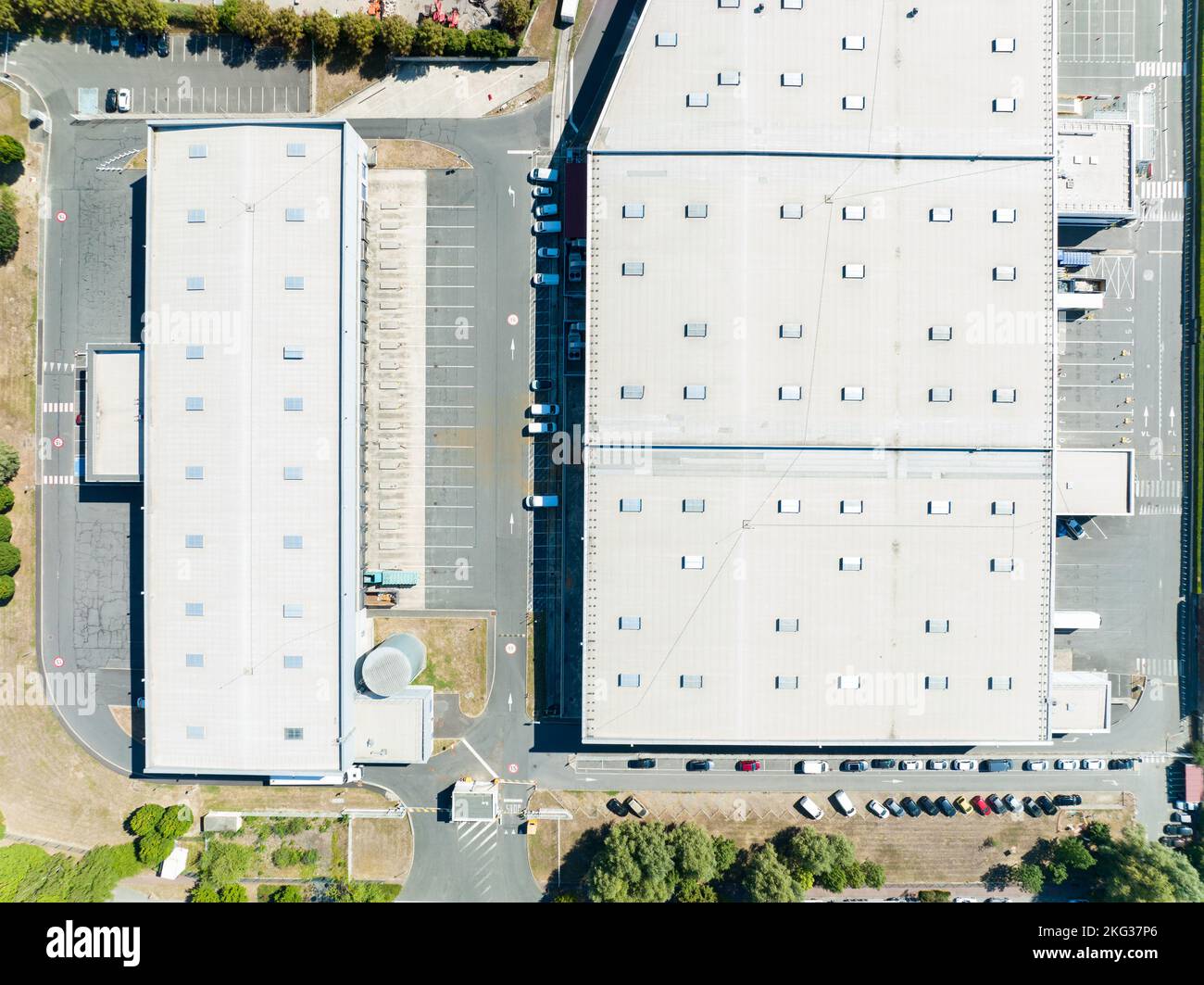 Top down shot of warehouse roof surrounded by trees Stock Photo - Alamy