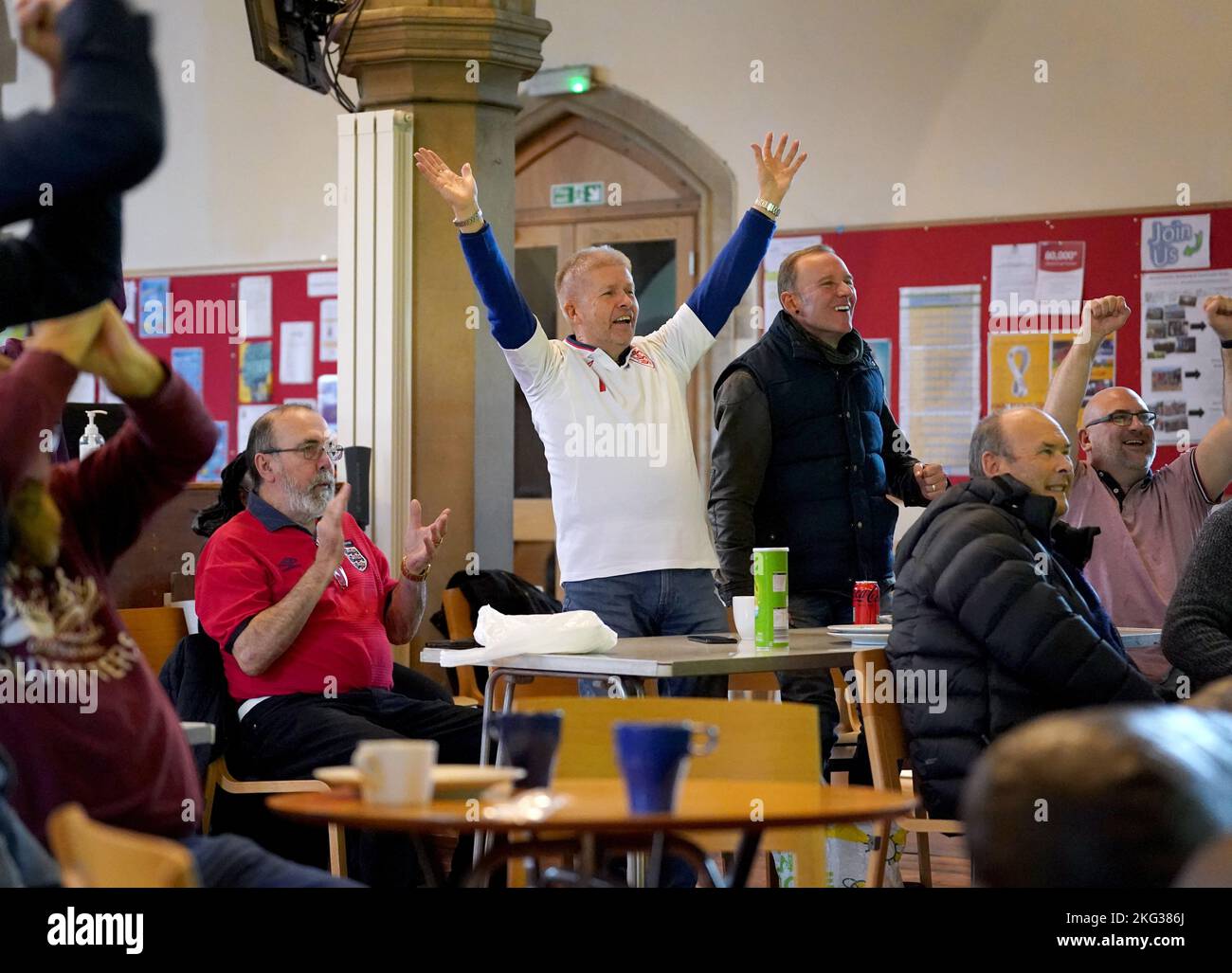 Fans celebrate England's first goal as they watch the England v Iran ...