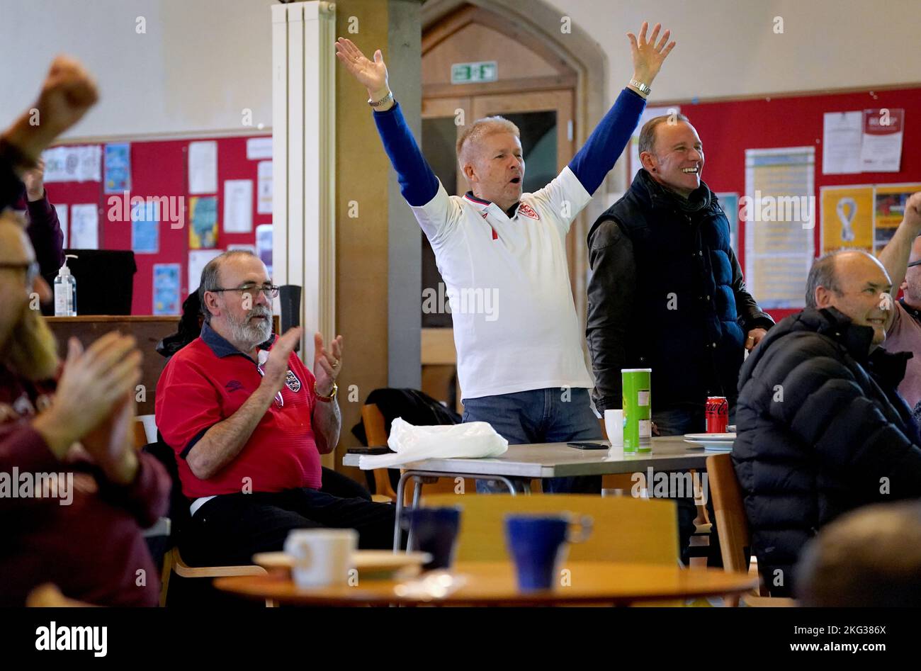Fans celebrate England's first goal as they watch the England v Iran ...