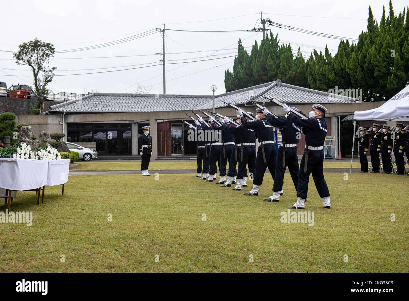 Japan Maritime Self-Defense Force members perform a gun salute during a ...