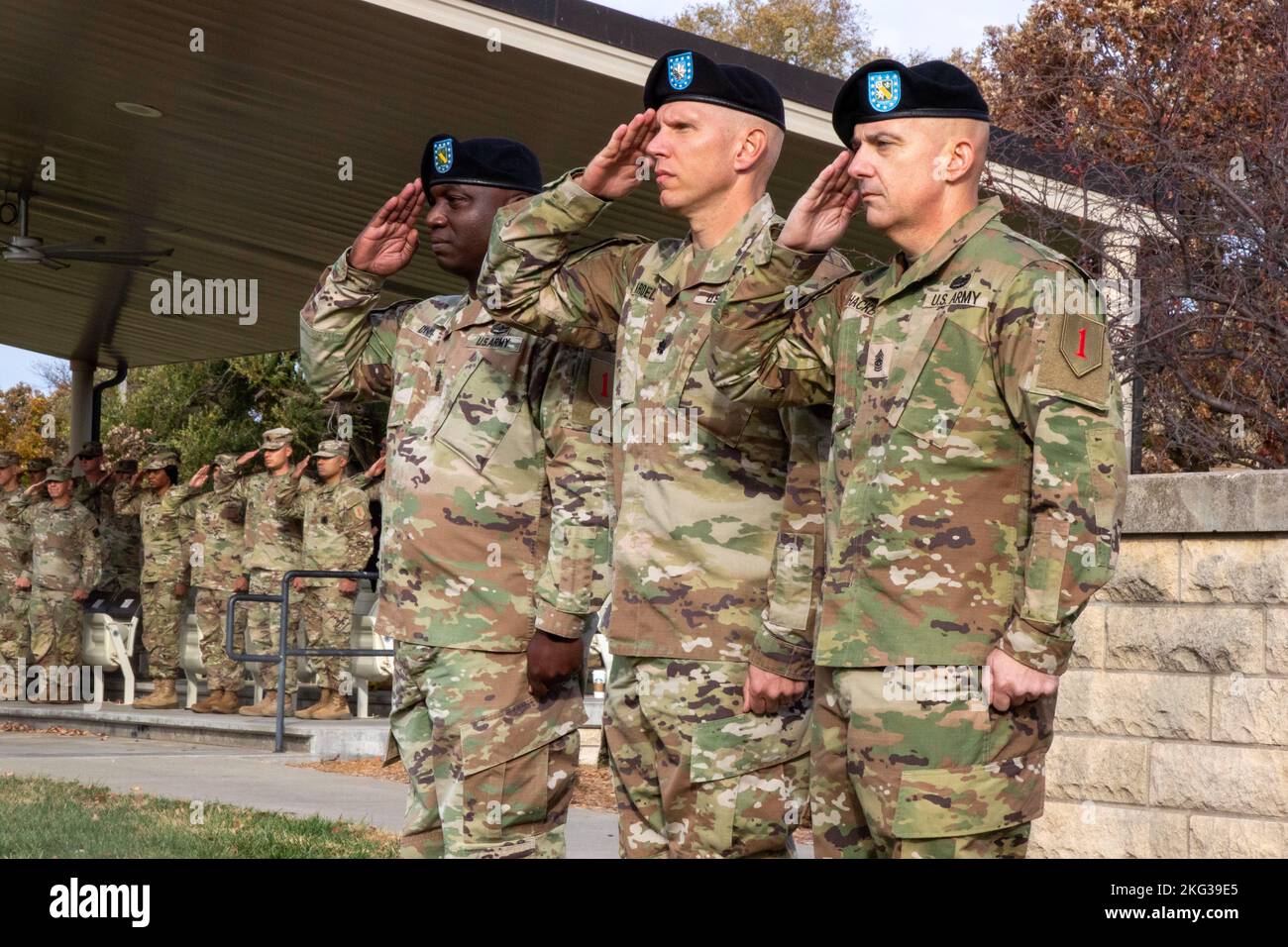 (Front left to right) U.S. Army Command Sgt. Maj. Mark L. Daniel, the outgoing 1st Combined Arms ...