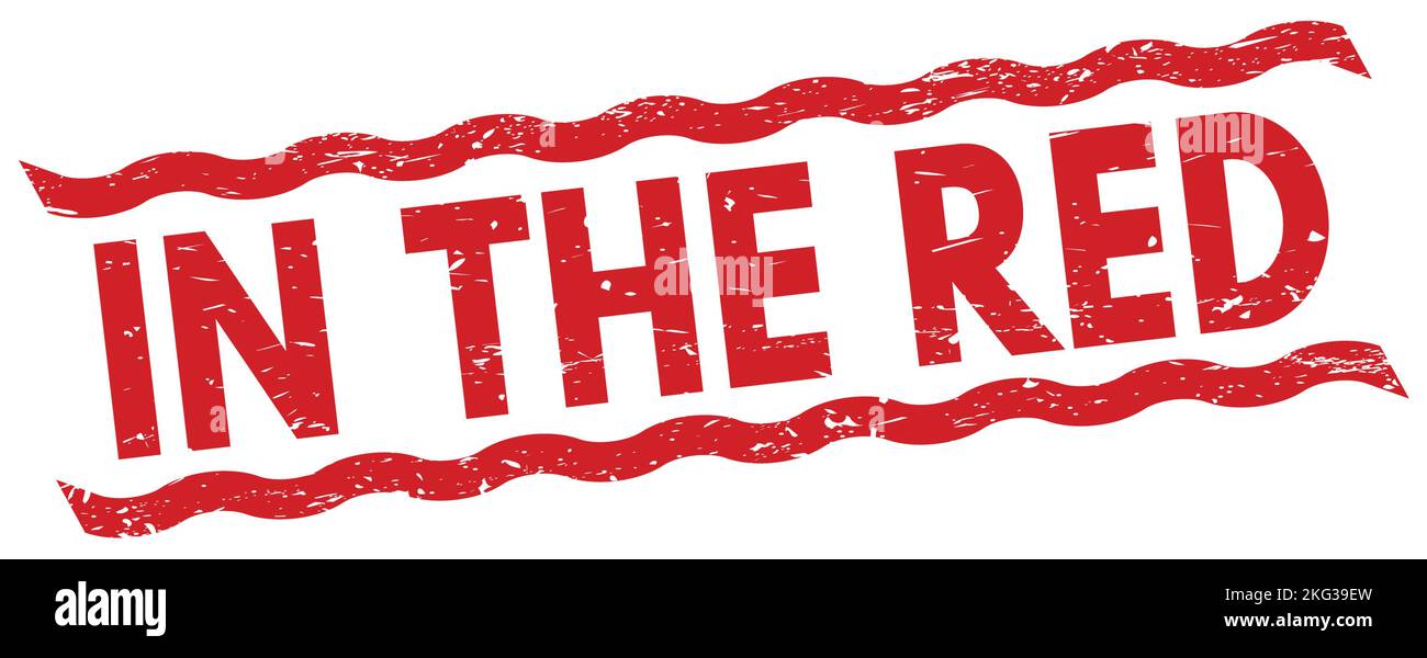 IN THE RED text written on red lines stamp sign Stock Photo - Alamy