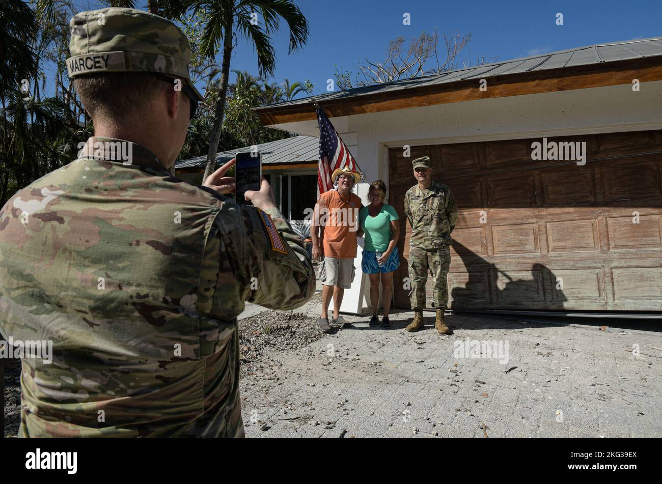 U.S. Army Cpt. Daniel L. Marcey takes photo of Major General William ...