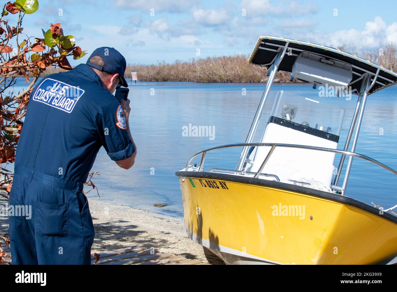 Coast Guard Petty Officer 1st Class Dustin Madden assesses a displaced ...