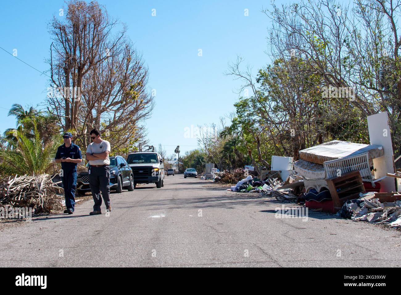 Coast Guard Petty Officer 1st Class Dustin Madden and Jon Belcher, an ...