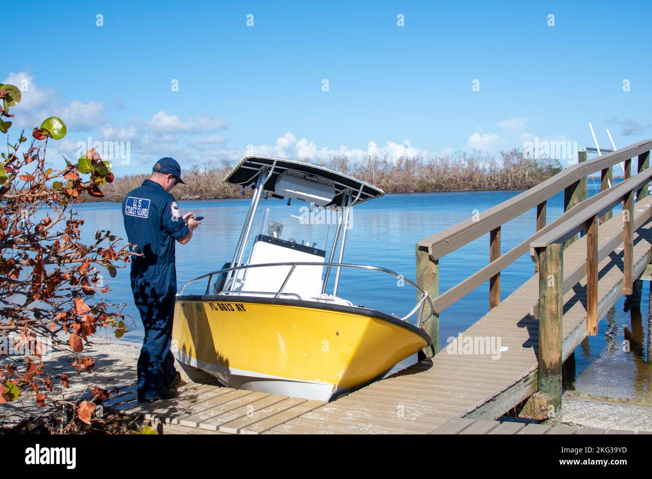 Coast Guard Petty Officer 1st Class Dustin Madden assesses a displaced ...