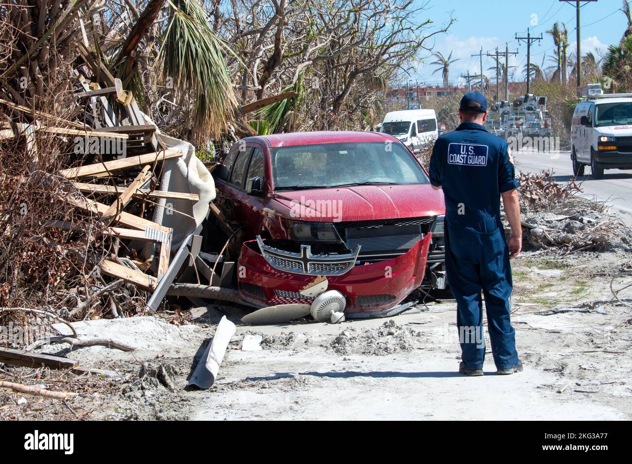 Coast Guard Petty Officer 1st Class Dustin Madden assesses a displaced ...