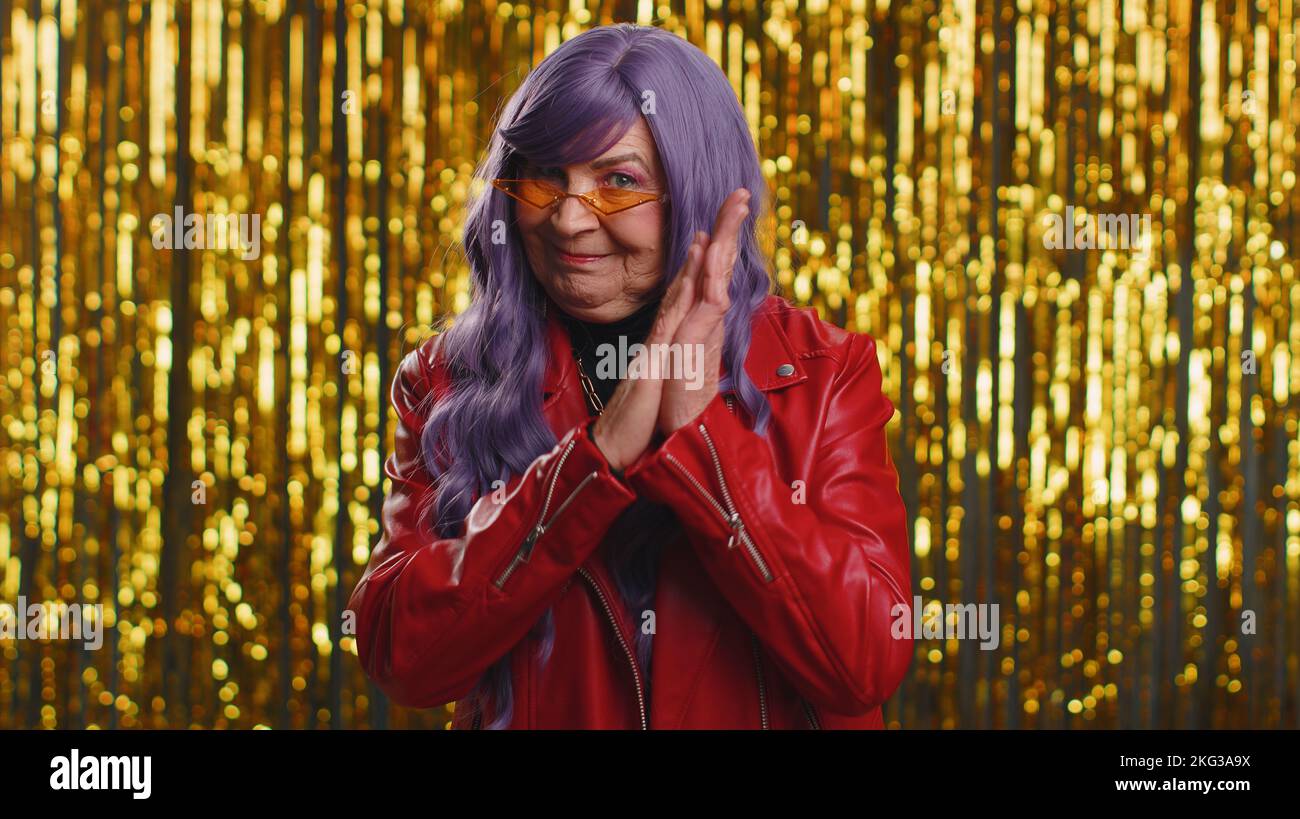 Sneaky cunning old woman with tricky face gesticulating and scheming ...