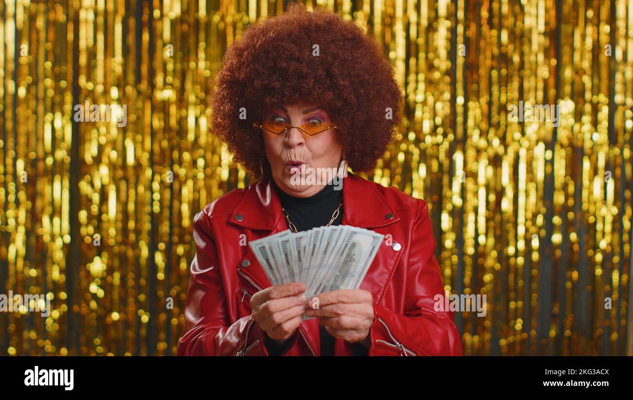 Female waving money hi-res stock photography and images - Alamy