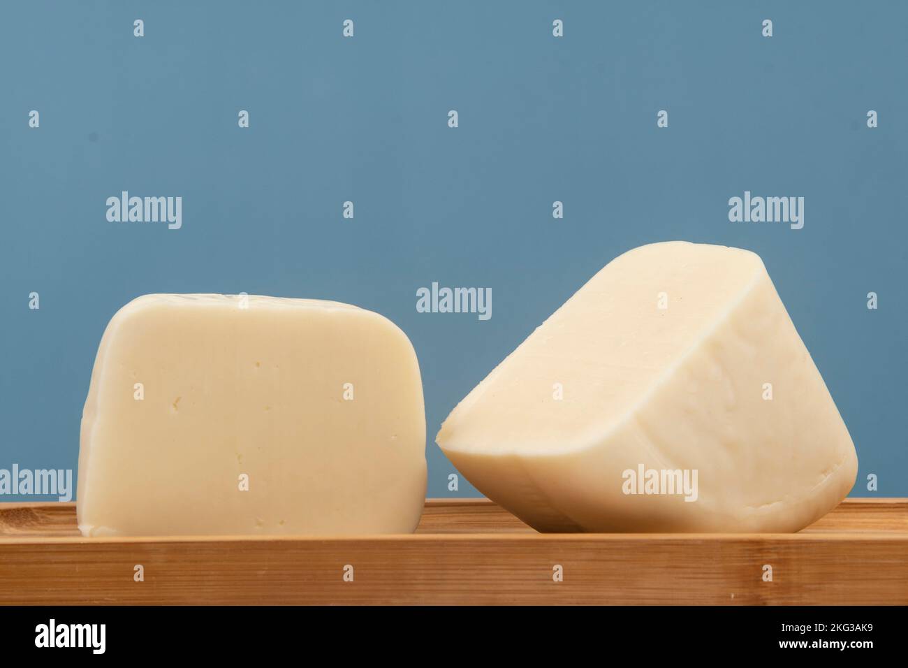 Minas half-cured cheese on a bamboo tray and isolated Stock Photo - Alamy