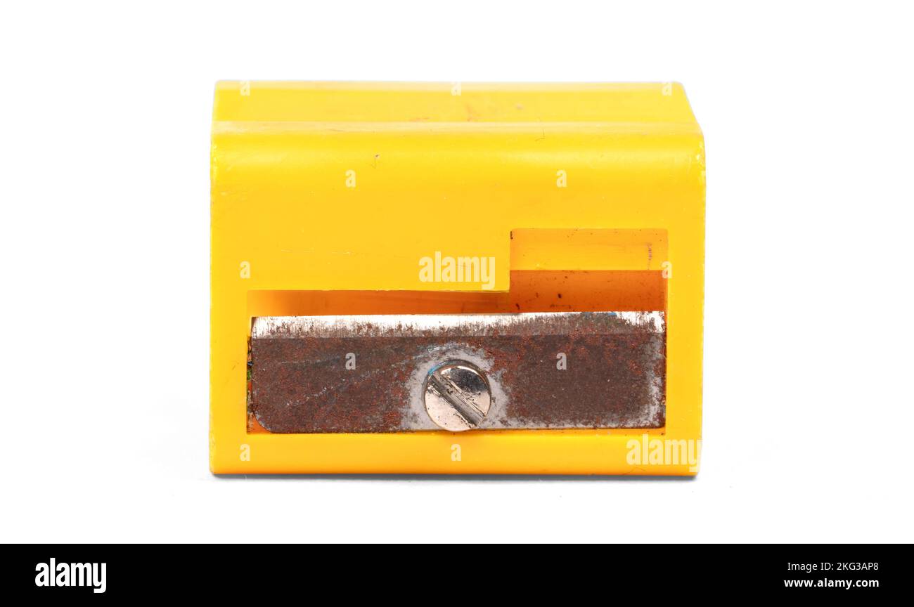 Close up old yellow pencil sharpener, isolated on white background ...