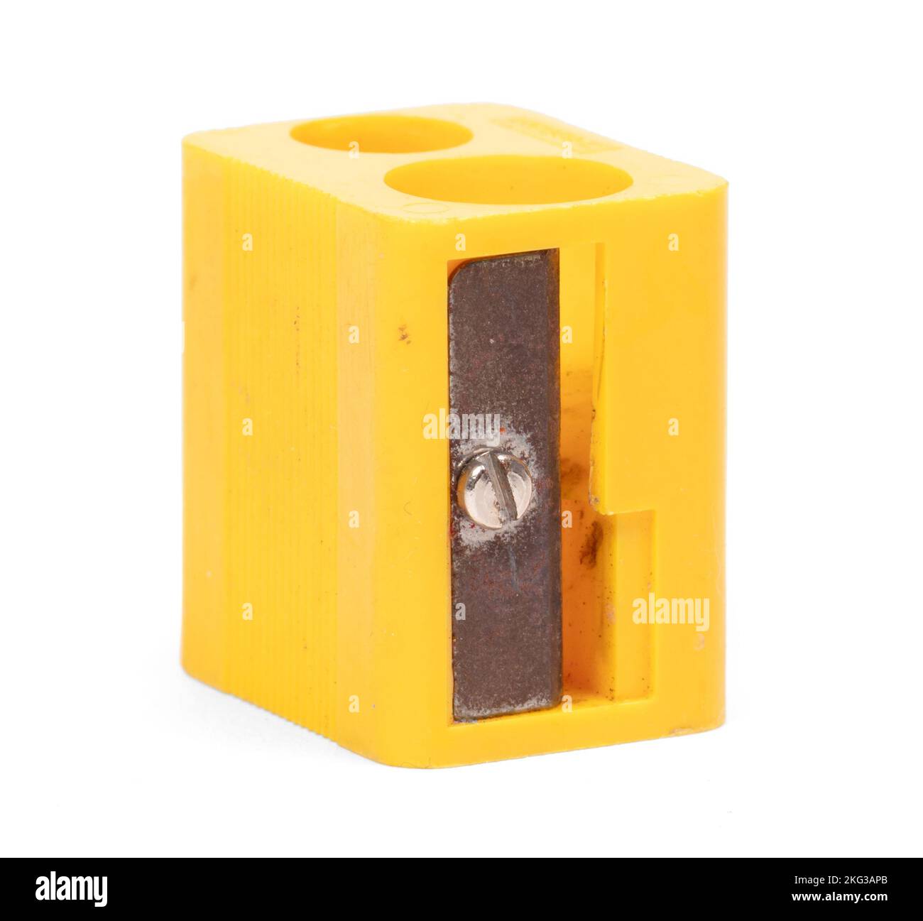 Close up old yellow pencil sharpener, isolated on white background ...