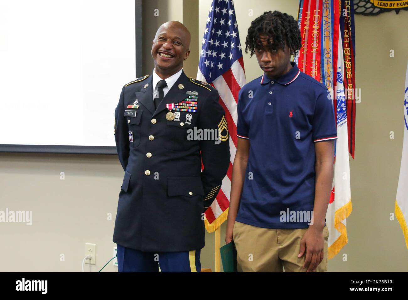 U.S. Army Sgt. 1st Class Terrance C. Smith smiles alongside his son at ...
