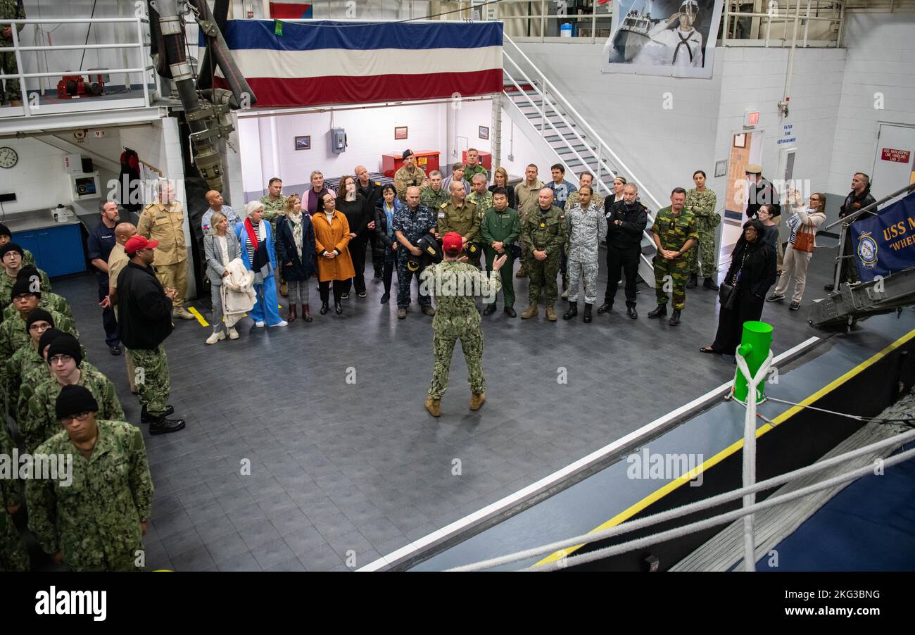 Attachés from foreign militaries observe a training evolution at USS Marlinespike training ...