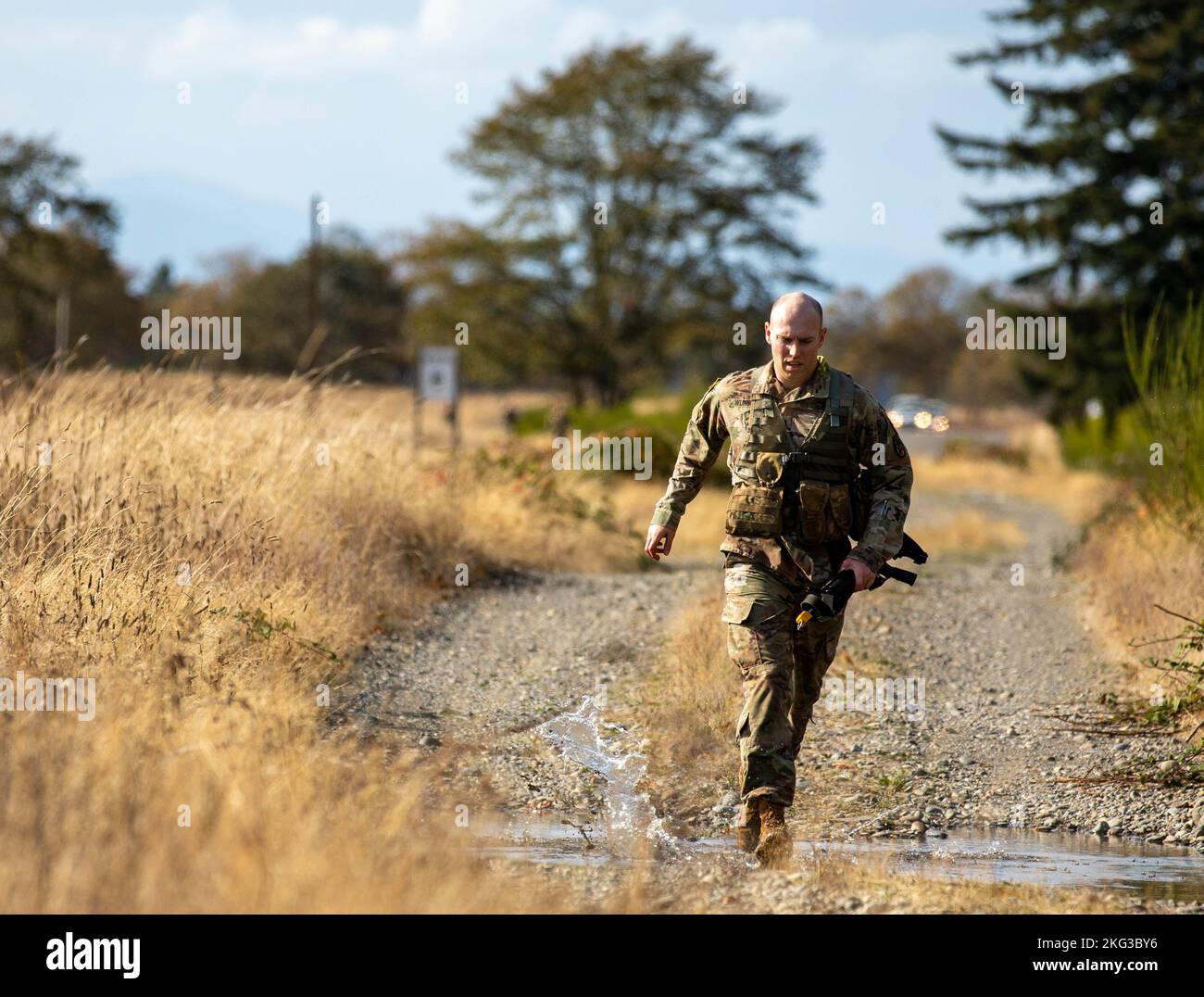 U.S. Army Capt. Christopher Wunsch runs along a tank trail during the ...