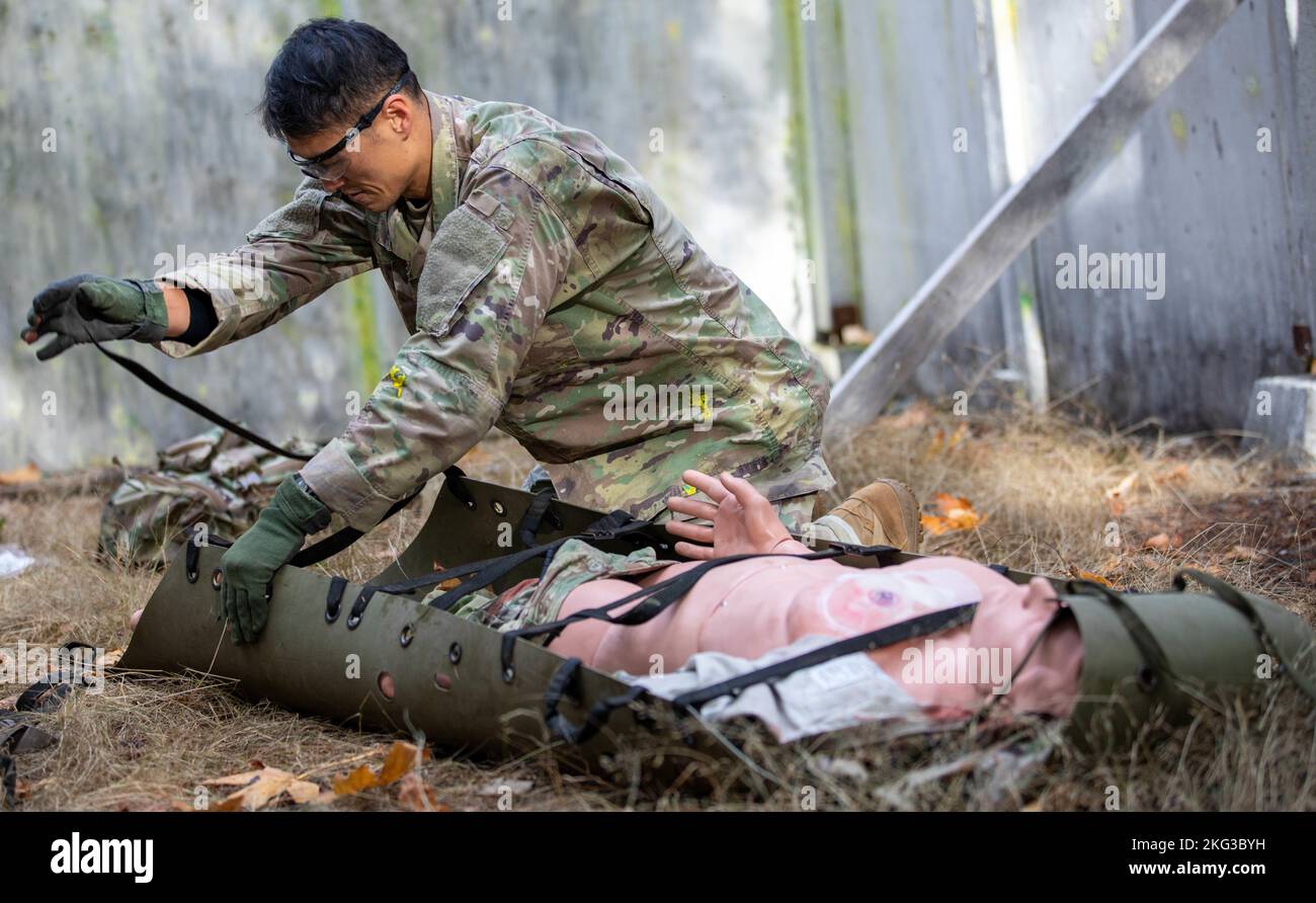 U.S. Army Staff Sgt. Heeyu Chang performs combat casualty care on a ...