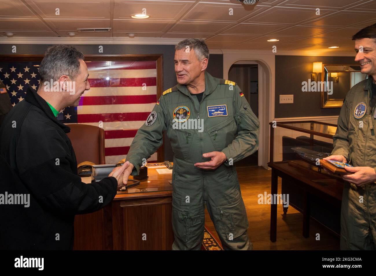 Rear Admiral. Greg Huffman, commander, Carrier Strike Group (CSG) 12, right, and Capt. Paul ...