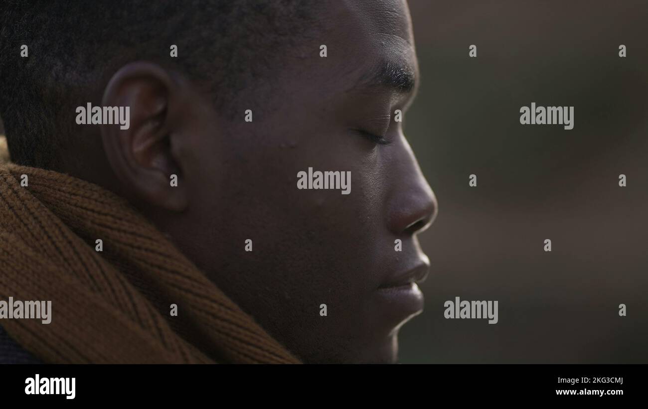 Meditative black man closing eyes in contemplation, close-up African person face Stock Photo - Alamy