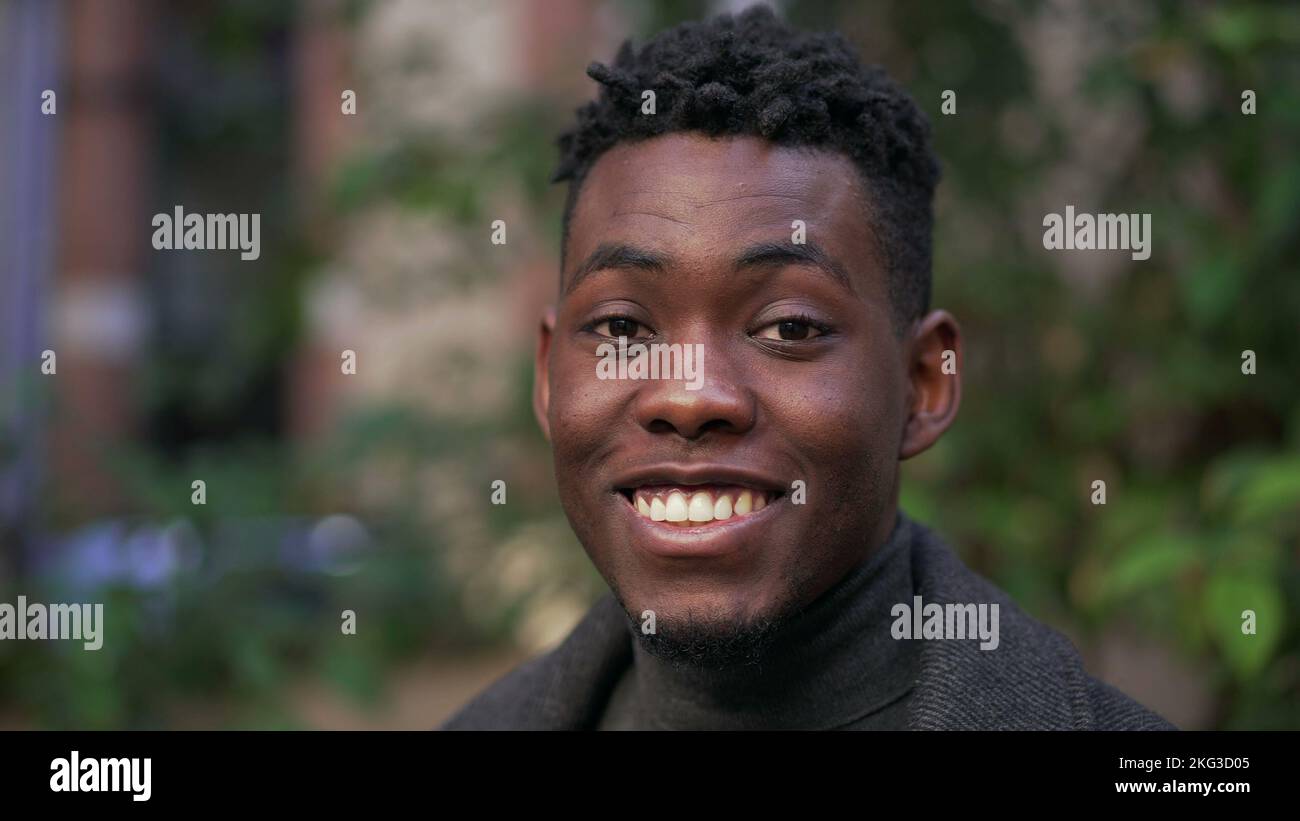 Happy satisfied black African portrait face close-up smile Stock Photo ...