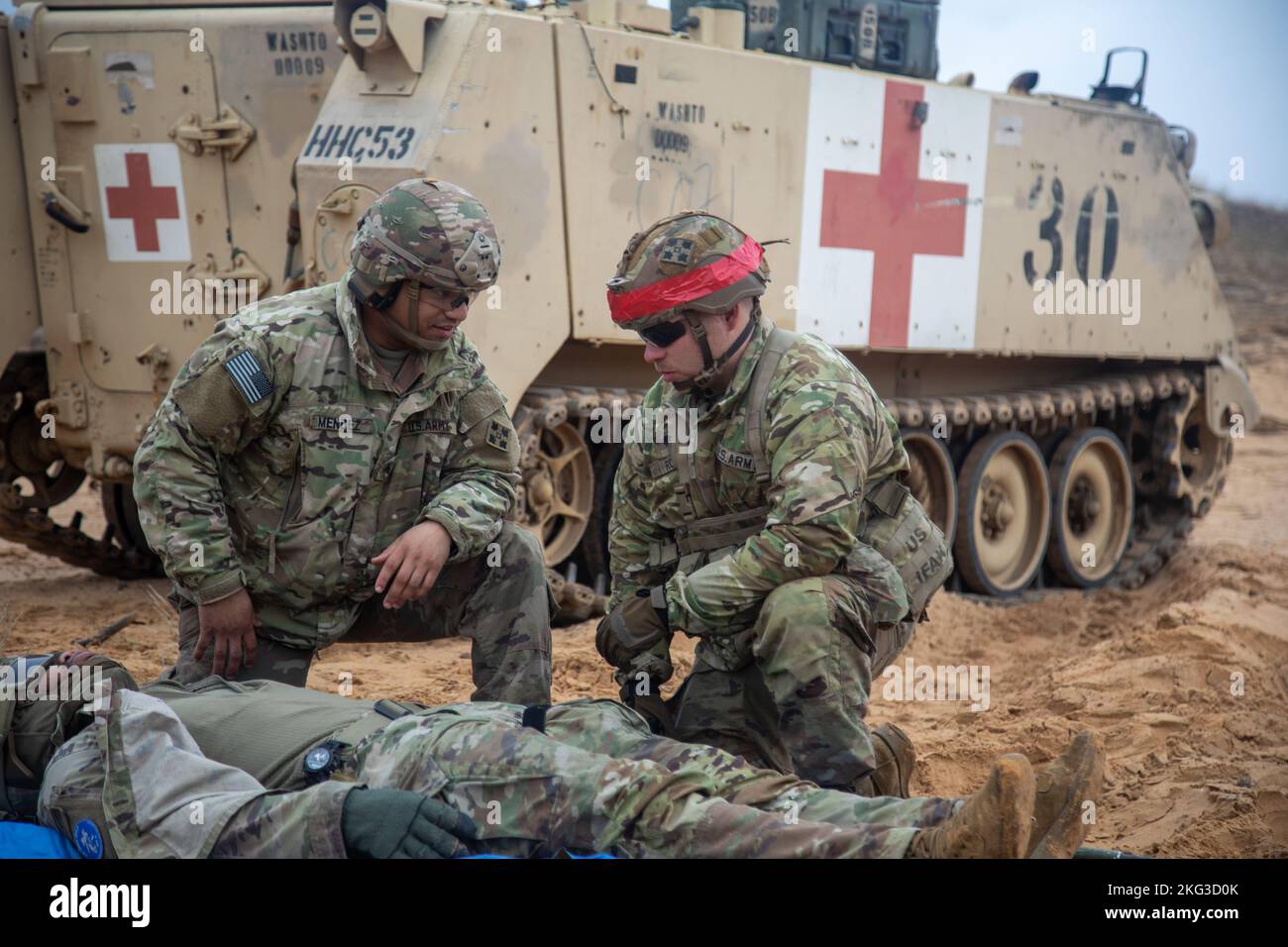 U.S. Army Sgt. Quentin A. Mendez, left, and Spc. Isaiah J. Rood, right ...