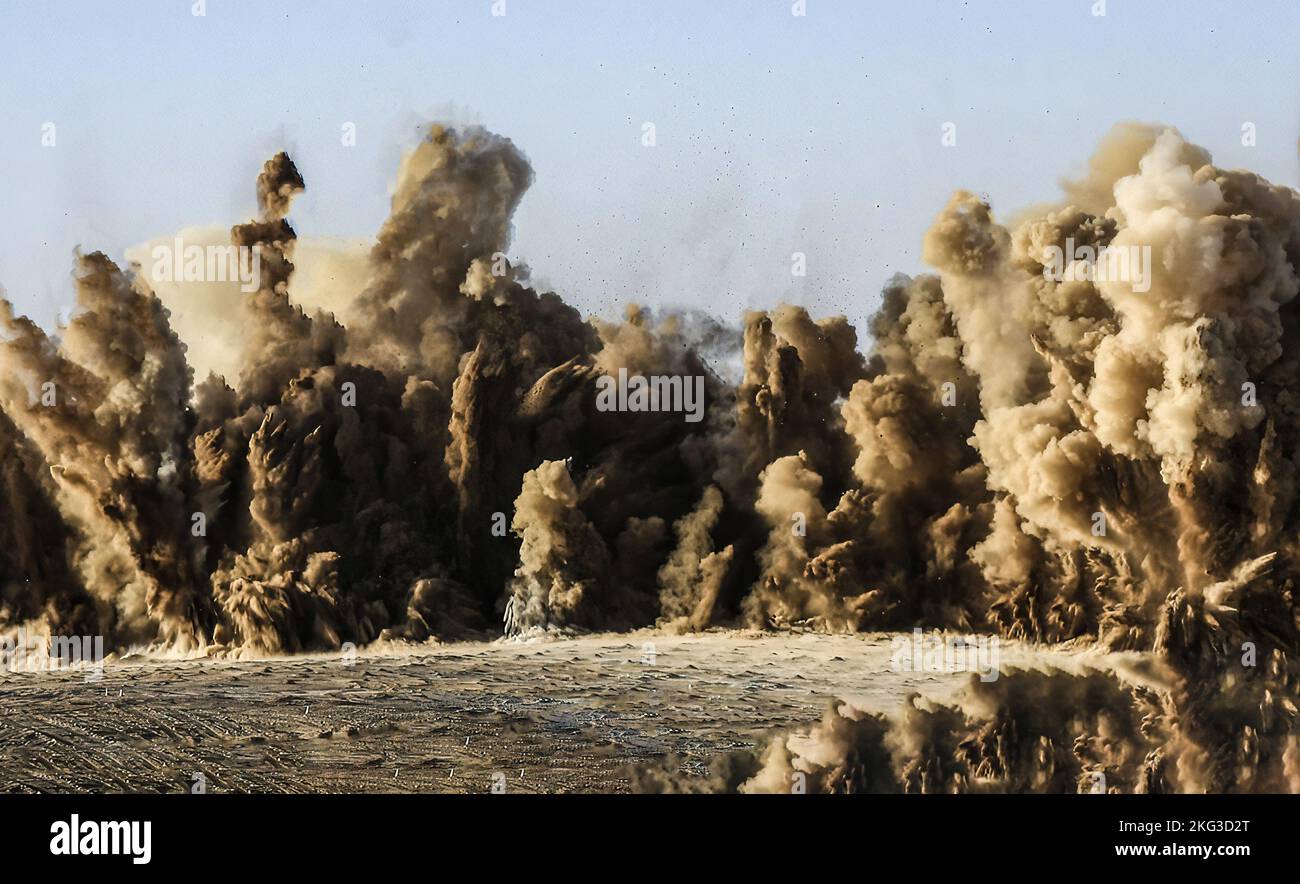 Dust clouds during detonator blast on the mining site in the Middle ...