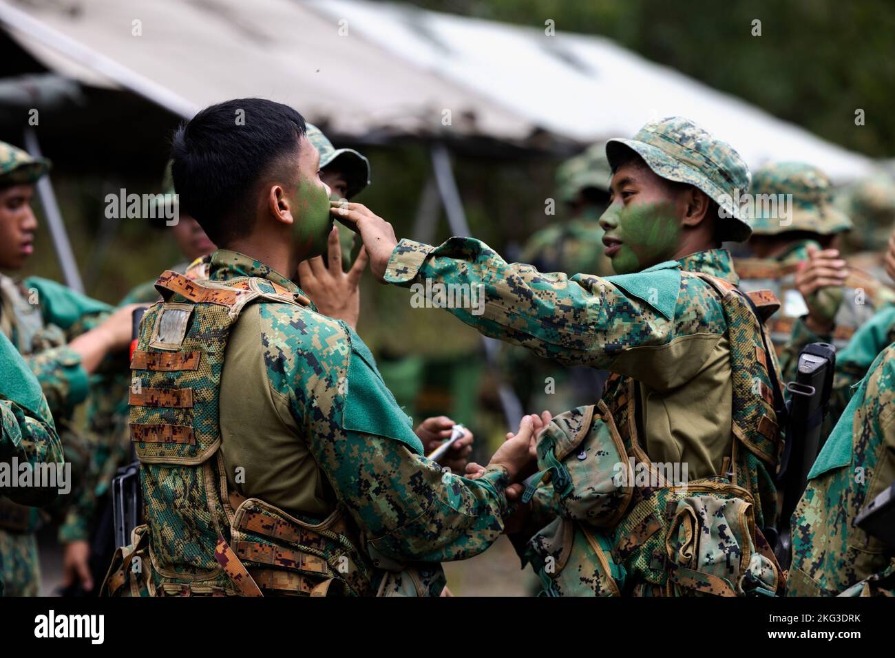 Royal Brunei Land Force (RBLF) soldiers with 2nd Battalion, RBLF, apply ...